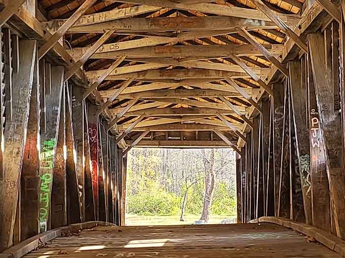 Hand-hewn timber arches stretch overhead inside the bridge, a cathedral of craftsmanship that no modern construction crew could replicate on a Tuesday.