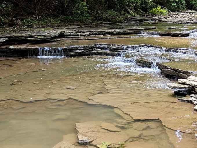 Water cascading over flat limestone shelves &mdash; nature's own architecture, no admission fee required.