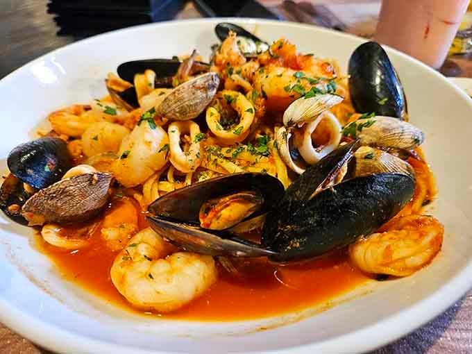 Prawns, mussels, clams, calamari, and linguine in one glorious bowl. The Pacific Northwest and Italy finally shook hands.