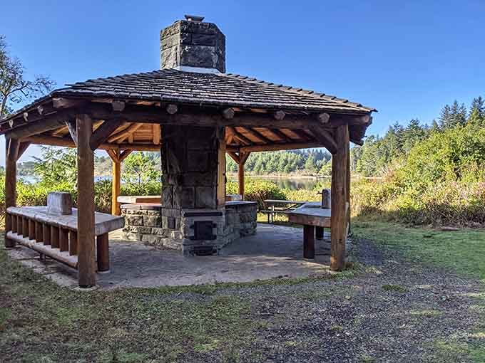 A stone fireplace, a lake view, and a wooden roof. This gazebo means serious business about relaxation.