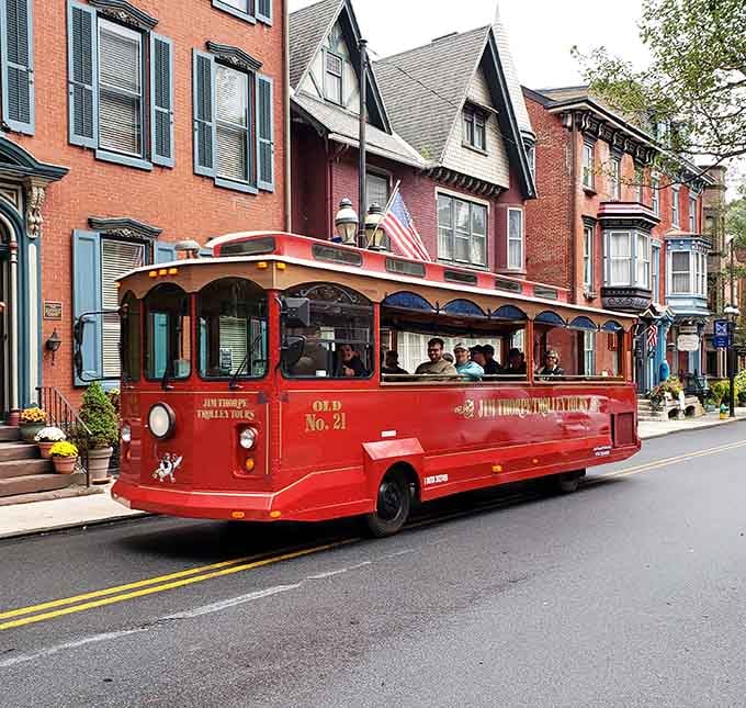 Jim Thorpe's cheerful red trolley rolls past rows of Victorian brick homes like a postcard that actually moves.