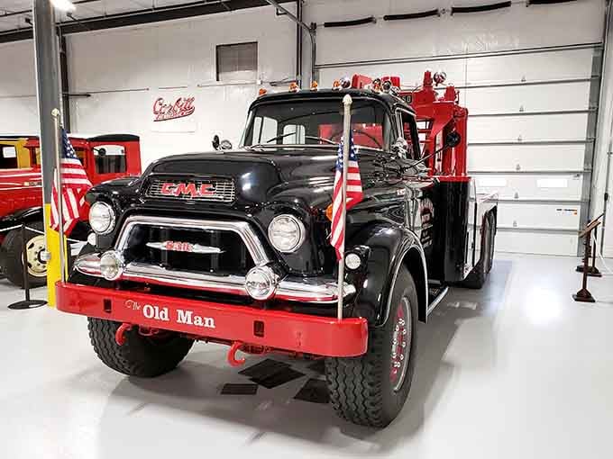 Nicknamed "The Old Man," this black and red GMC tow truck has clearly earned every bit of that title.