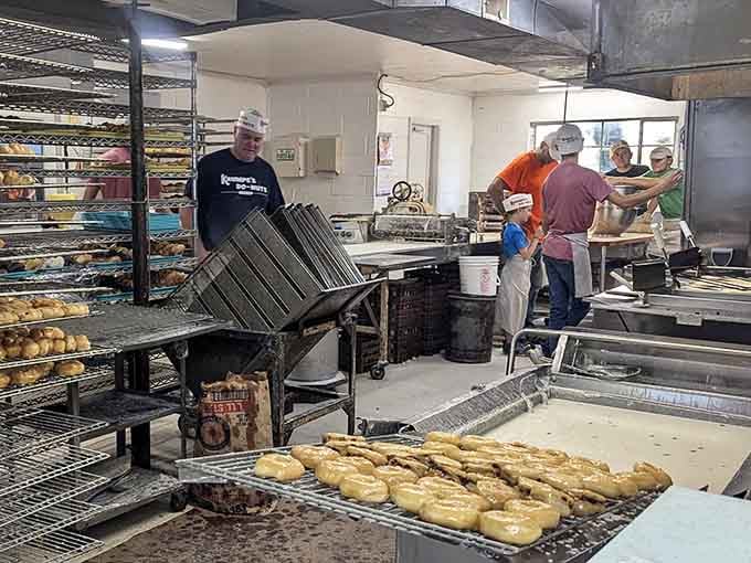 The donut assembly line in action, where ordinary ingredients transform into late-night legends every single evening.