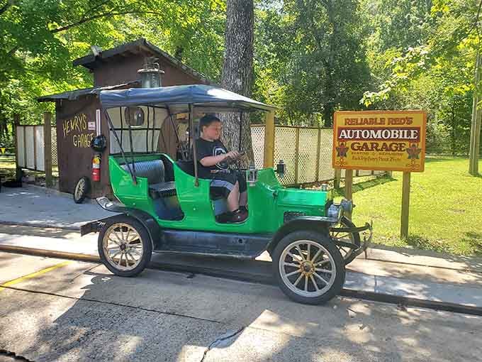 Cruising past "Reliable Red's Automobile Garage" in a bright green vintage car, this is the kind of ride that never gets old.
