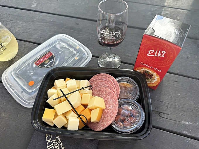 A handcrafted cheese and charcuterie tray paired with a Lakeridge glass is basically a love letter written in food.