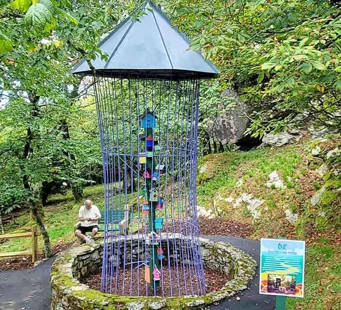 A birdhouse tower tucked into the mountain greenery. Even the birds here seem to be living their best Oz life.