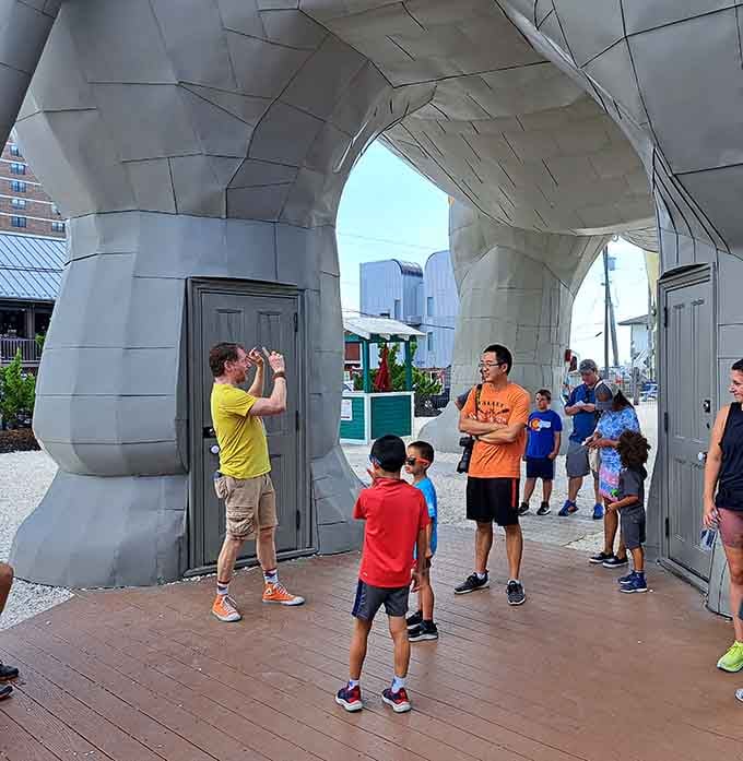 Families gather to enter through Lucy's leg, because normal doorways are for buildings that aren't shaped like elephants.