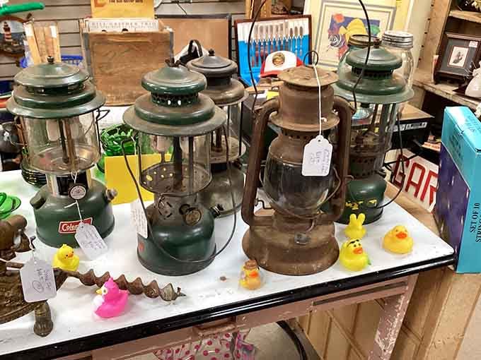 Vintage Coleman lanterns lined up like old soldiers, ready for one more adventure around the campfire.