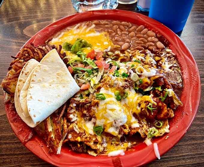Chilaquiles that transform breakfast into an event worth waking up early for, crispy and saucy in perfect harmony.