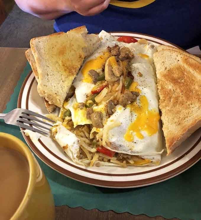 Lauren's Omelette is packed with sausage, broccoli, and cheddar. Lauren, whoever you are, you made excellent choices.