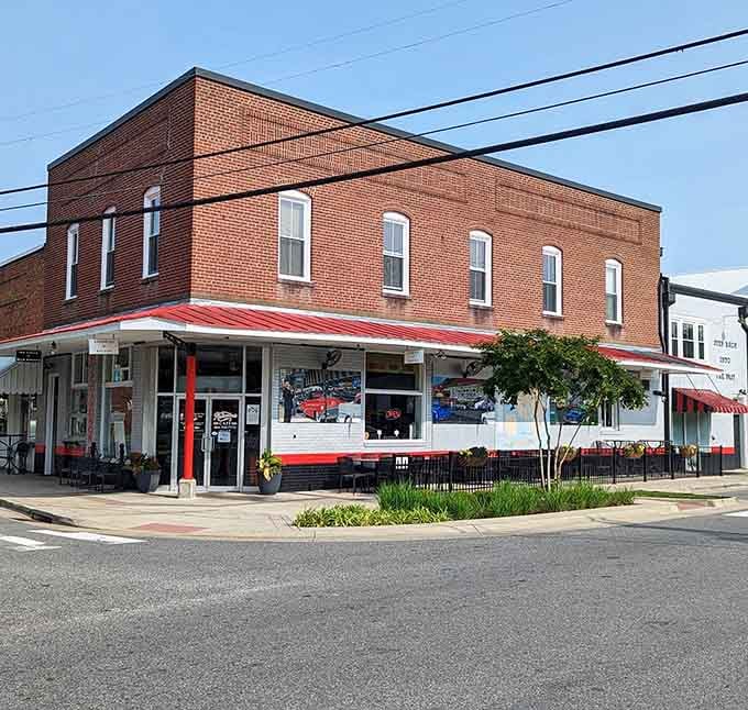 Red awning, corner location, and a building that's been holding down that intersection with quiet confidence for a very long time.