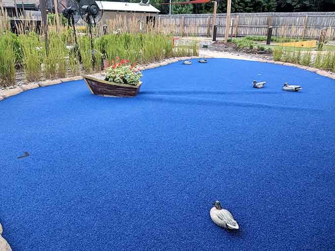 Blue turf, decoy ducks, and a little wooden boat, this hole is basically a Swiss lake in miniature.