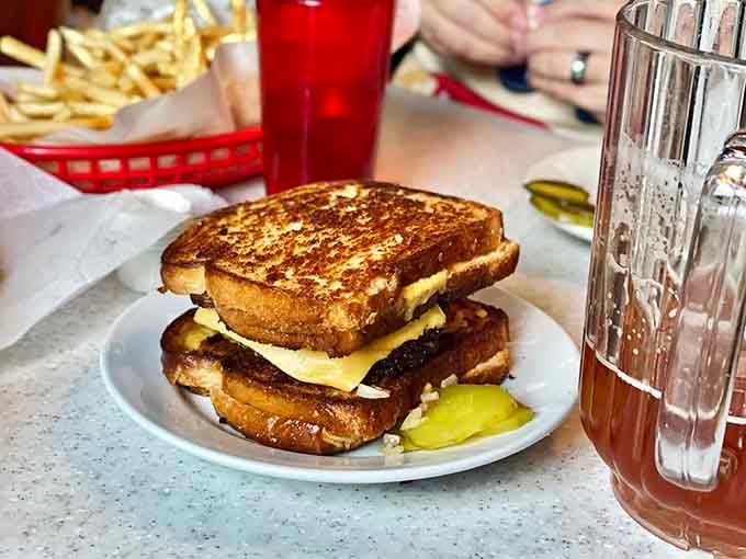 Golden-toasted bread, melted cheese, and a side of pickles, this grilled cheese is proof that the classics never go out of style.