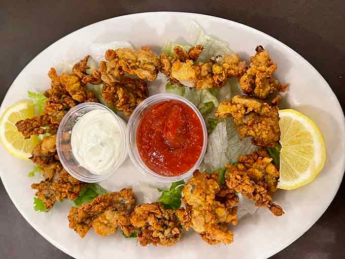 Fried oysters fanned out with cocktail sauce and tartar. This plate looks like it arrived ready for its close-up.