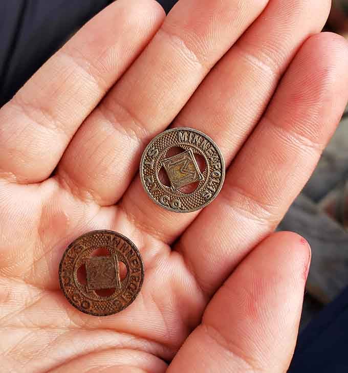 Old Minneapolis transit tokens, small enough to fit in your palm, big enough to carry a whole city's history.