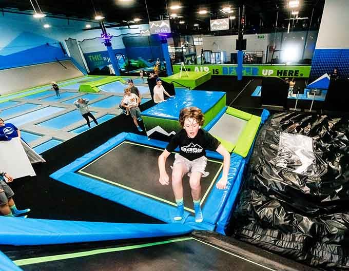 Pure joy captured mid-bounce, proving that flying through the air never gets old, regardless of your actual age here.