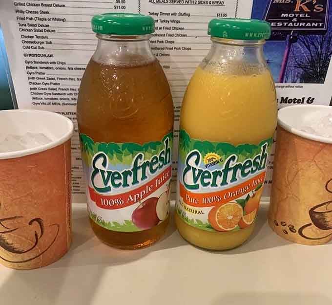 Two cold bottles of juice sitting at attention, ready to report for breakfast duty immediately.