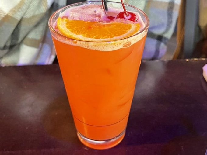 That orange glow, the cherry on top, the orange slice. This drink showed up dressed better than most people.