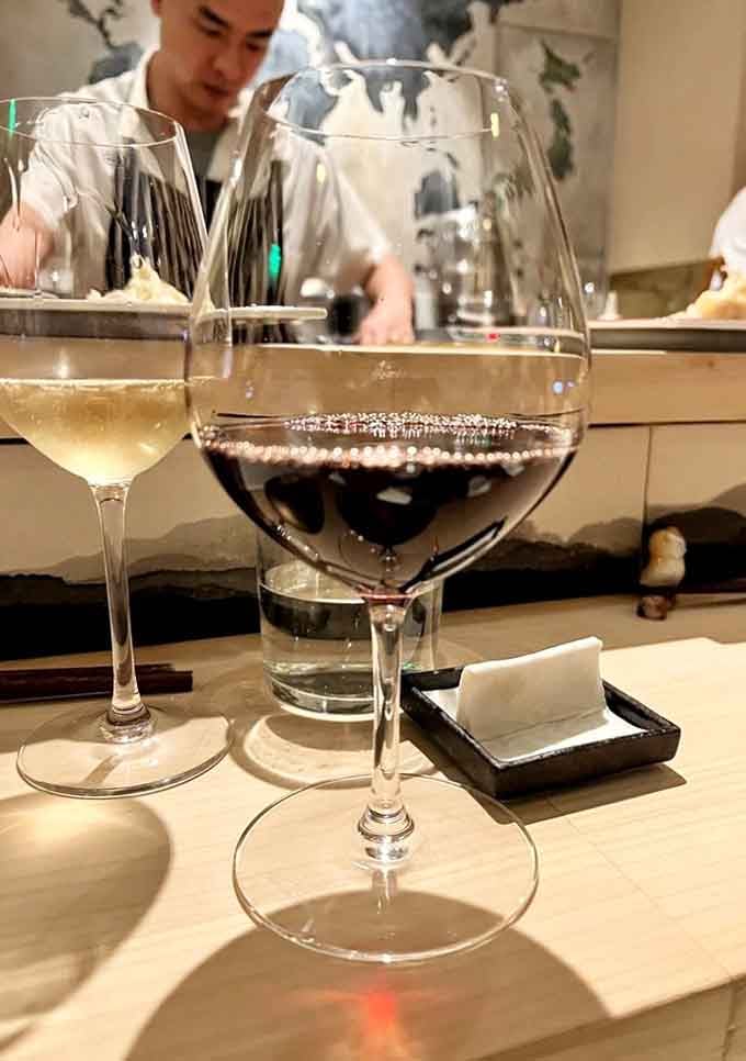 Two glasses, one chef working quietly in the background, and the kind of calm that only arrives when the evening is going exactly right.