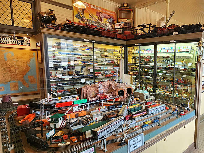 A full model train layout spread out like a miniature world, complete with tunnels, tracks, and pure childhood wonder.