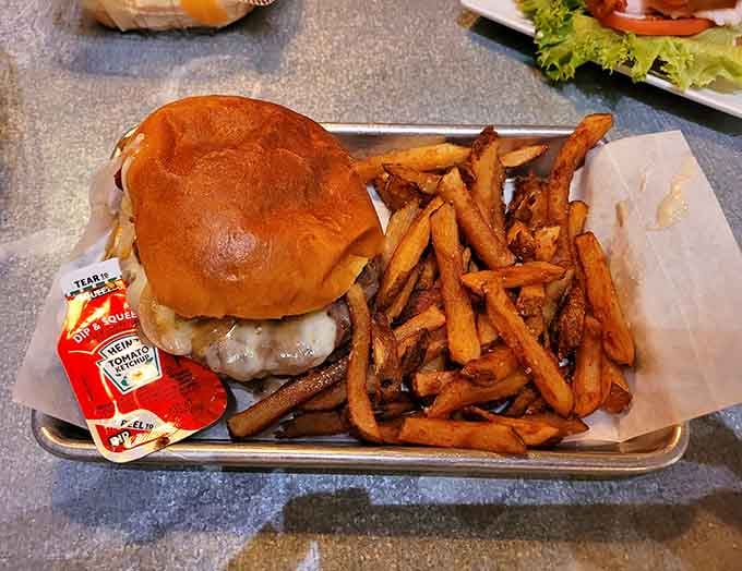 A juicy burger with melted cheese and crispy fries&mdash;proof that this gas station takes its food as seriously as its fuel.