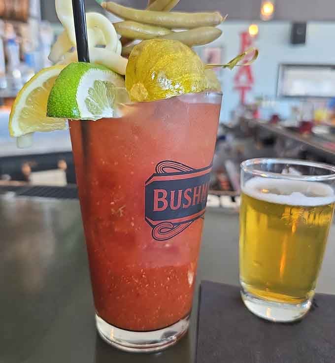 Wisconsin's legendary Bloody Mary tradition, fully loaded with pickles, citrus, and a beer chaser standing by like a loyal sidekick.