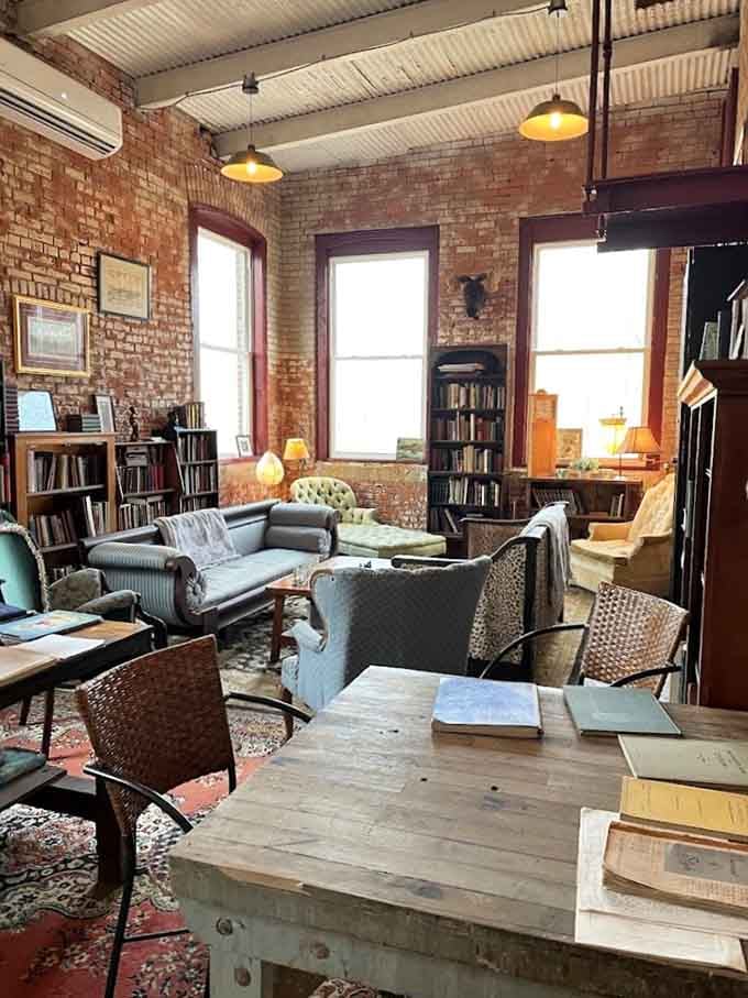 Tall windows flooding the room with light, mismatched sofas calling your name, and books on every wall within arm's reach.
