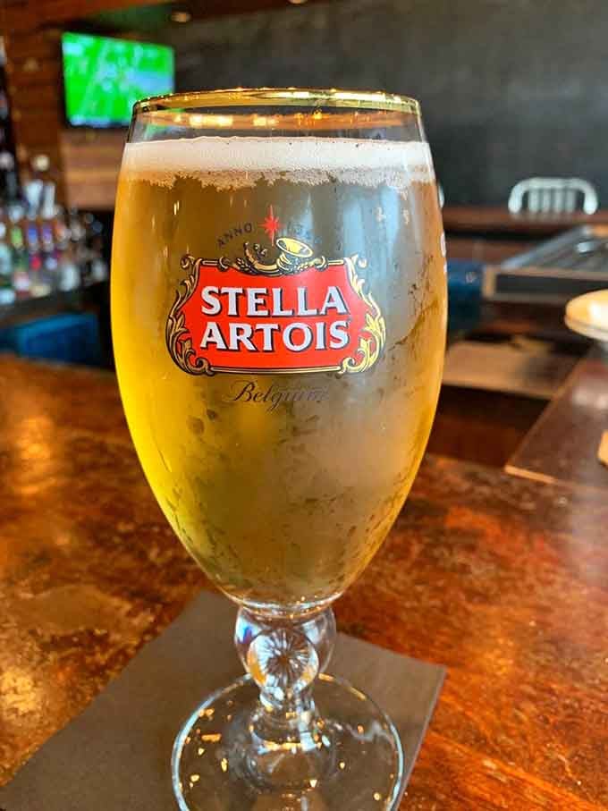 A cold Stella Artois in a proper chalice glass, because some meals deserve the right companion drink.