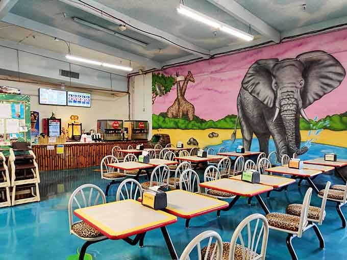 Leopard-print chair cushions, elephant murals, and a snack bar. Even the dining room commits to the theme.