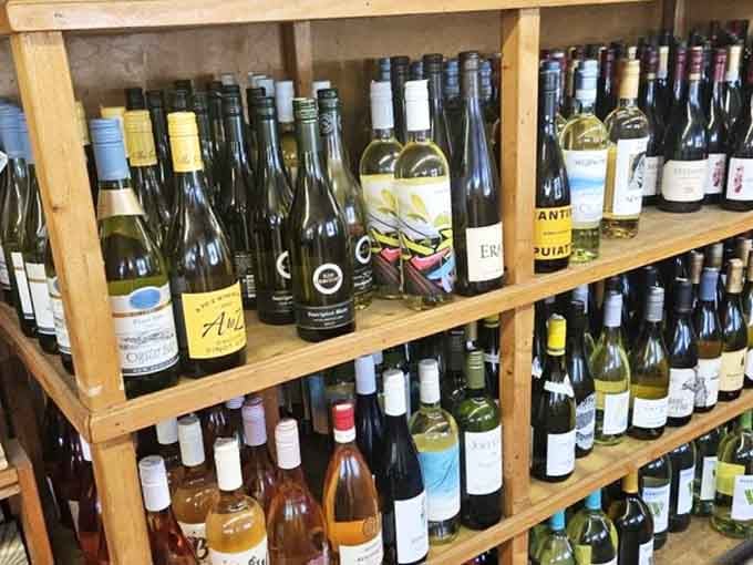 Wooden shelves lined with wine bottles inside a gas station barbecue joint, Micanopy plays by its own rules.