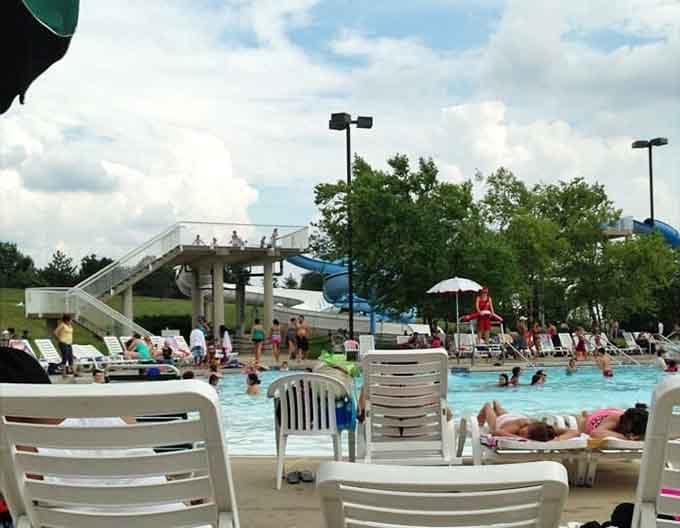 Happy visitors, lounge chairs, and big outdoor slides in the background. Summer in Bolingbrook looks pretty good.