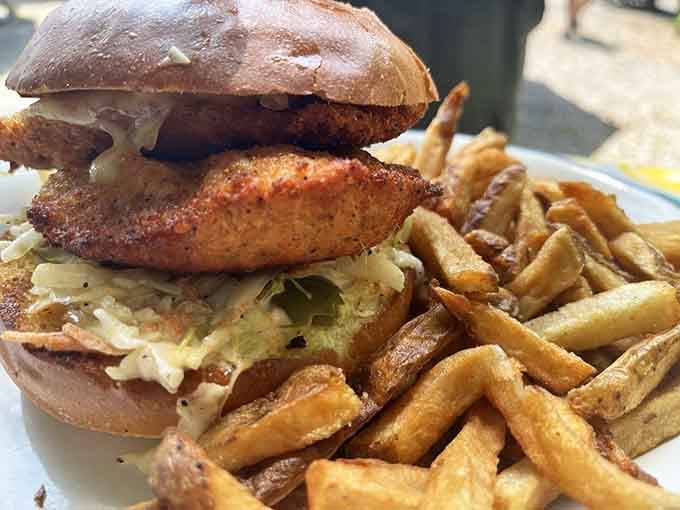 That fried chicken sandwich with crispy fries represents everything right about elevated diner food done perfectly.