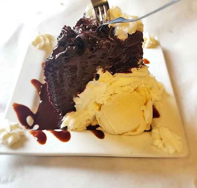 Rich chocolate fudge cake with vanilla ice cream and chocolate drizzle. Dessert this good deserves its own standing ovation.