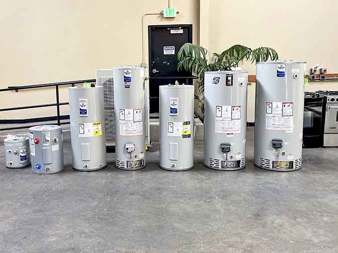A lineup of water heaters standing at attention, proof that even the most unglamorous home essentials deserve a second chance.