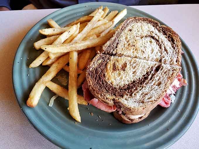 A proper Reuben on toasted rye with a side of fries. Classic never goes out of style, and neither does this.
