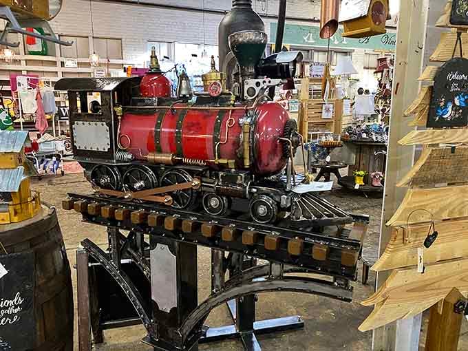 A handcrafted steam locomotive sculpture sits mid-floor, bold and unapologetic, demanding your attention like a freight train that knows it's beautiful.