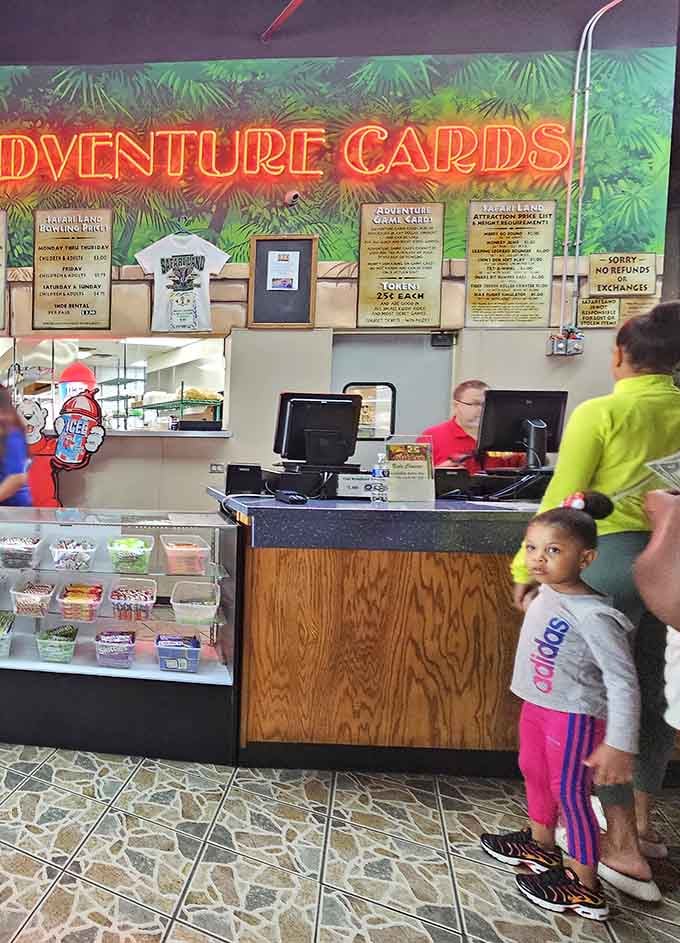 The glowing "Adventure Cards" sign is basically the Safari Land version of a golden ticket, and everyone wants one.