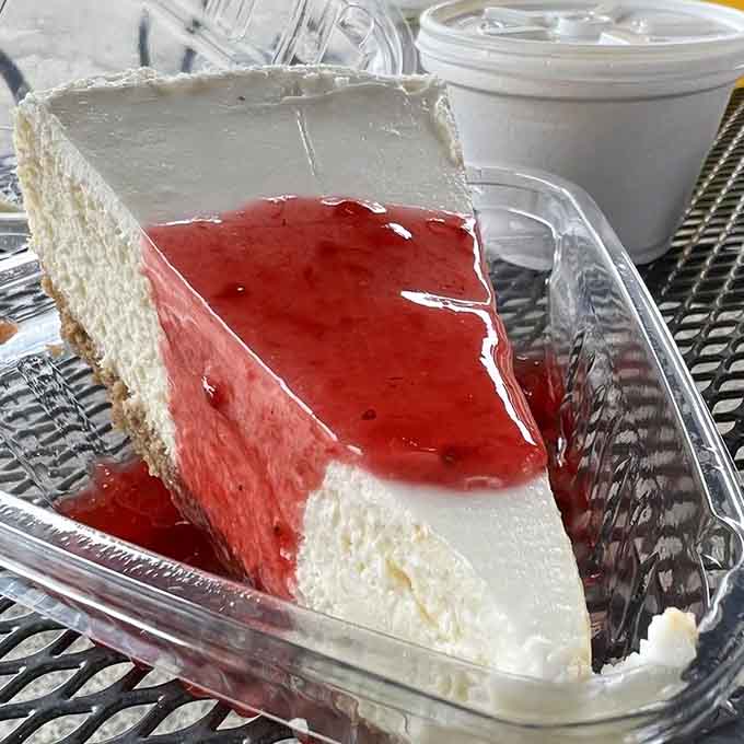 Cheesecake with strawberry topping that's smoother than a jazz saxophone solo on a Sunday afternoon.