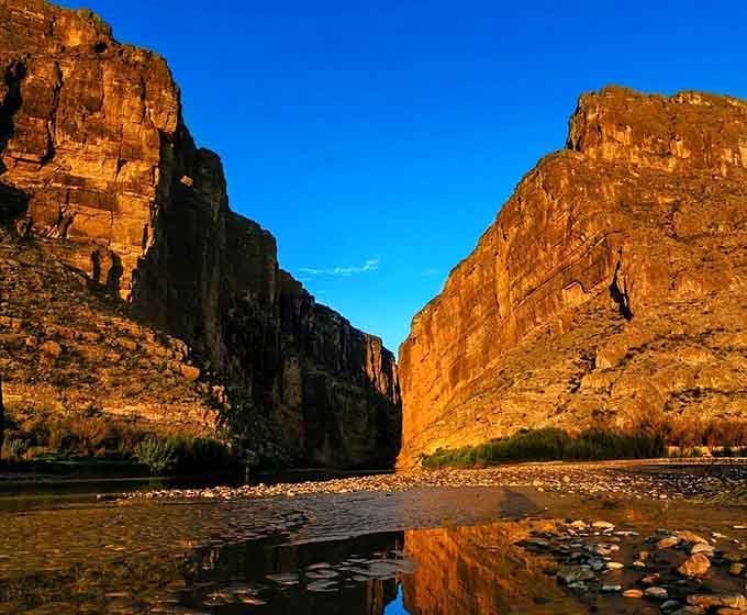Golden hour hits different when 1,500-foot walls are doing the reflecting. Pure Texas magic, no filter needed.