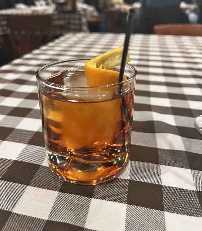 A proper bourbon, a checkered tablecloth, and nowhere else you need to be right now.