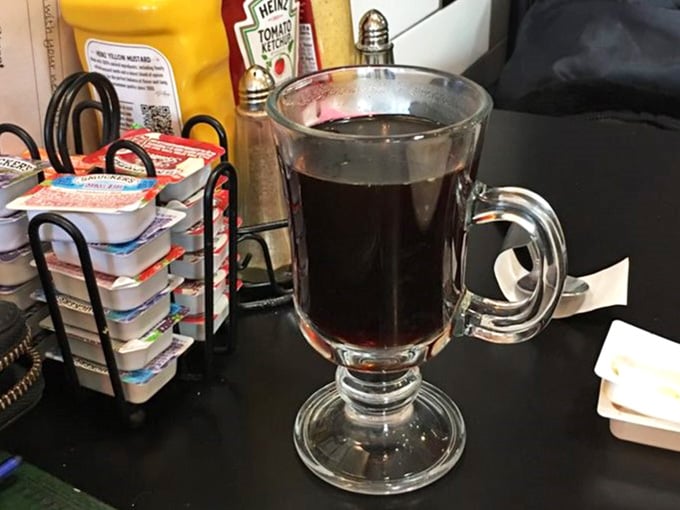 Coffee served in a proper glass mug, because some places still understand that the little details matter enormously.