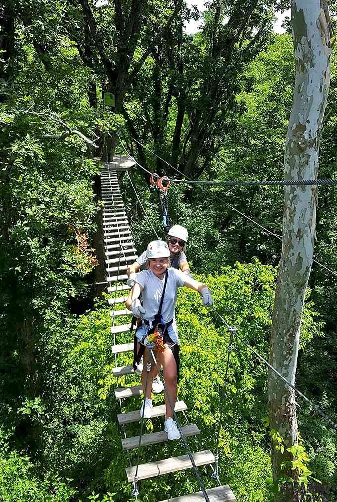 Two friends on a suspension bridge, proving that the best adventures are always better shared.