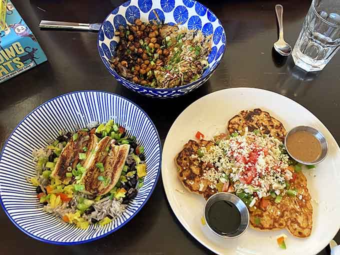 Grain bowls and corn cakes sharing the table like old friends. This kitchen is clearly having a very good time.