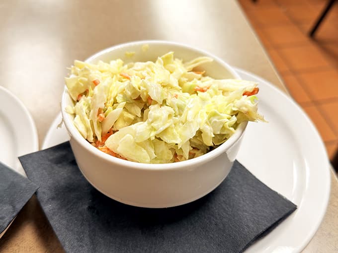 Cool, crisp, and creamy, this coleslaw is the perfect sidekick to any sandwich on the menu.