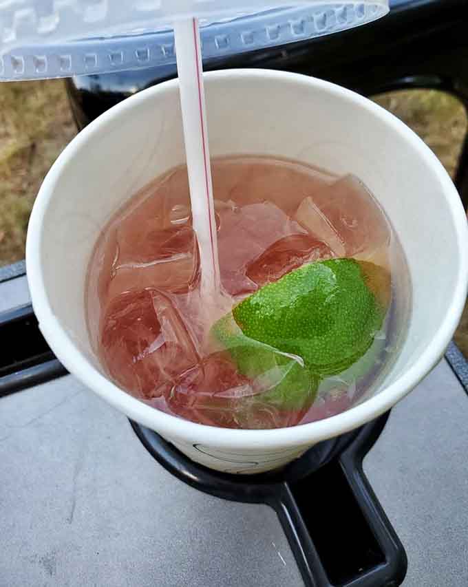 A raspberry lime drink with a fresh lime wedge, simple, refreshing, and exactly right for a warm Massachusetts afternoon.