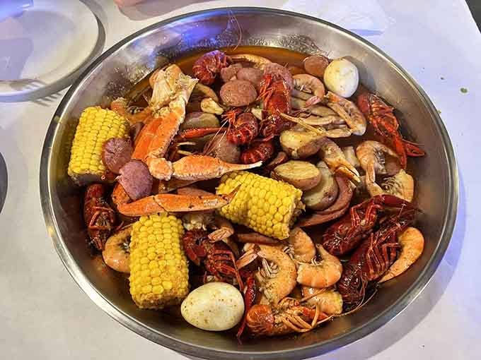 Crawfish, shrimp, crab, corn, sausage, and potatoes all piled into one glorious bowl. Missouri just called Louisiana and said, "Hold my hot sauce."