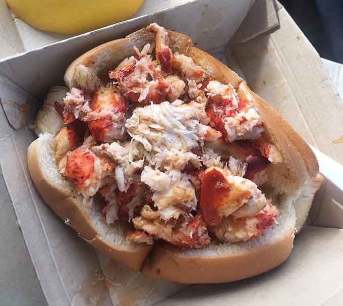 Generous chunks of sweet lobster spilling over a soft roll is the kind of sight that stops conversation cold.