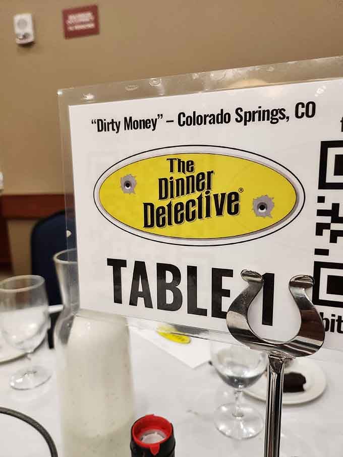 Table one at the Colorado Springs show, where "Dirty Money" is the mystery and dinner is very much included.