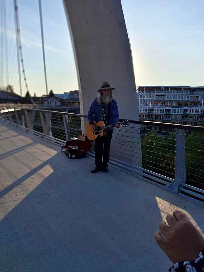 Nothing says "authentic experience" like a troubadour serenading sunset strollers with heartfelt melodies and weathered charm.