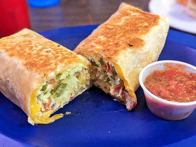 A breakfast burrito stuffed so full it barely holds together, which is exactly how it should be.